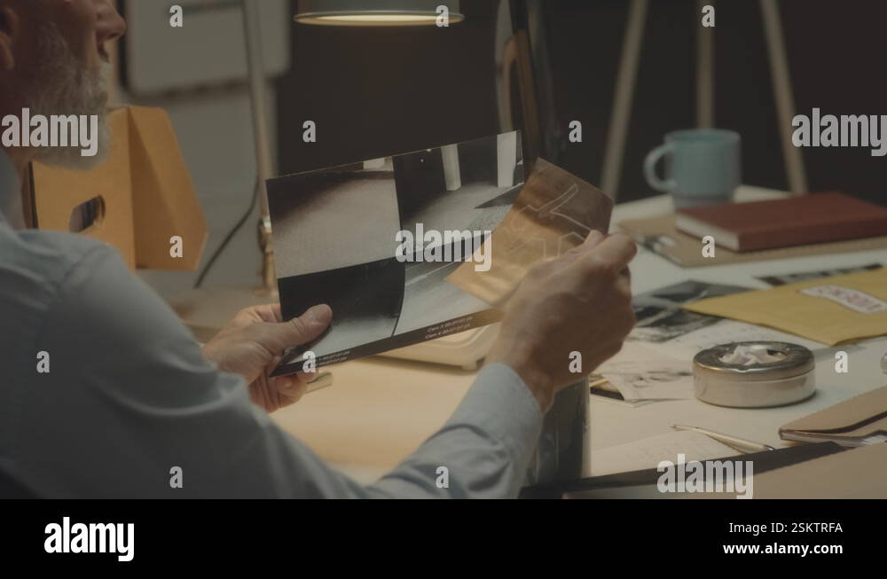 FBI Agent Examining Crime Scene Photos in Office Stock Video Footage ...