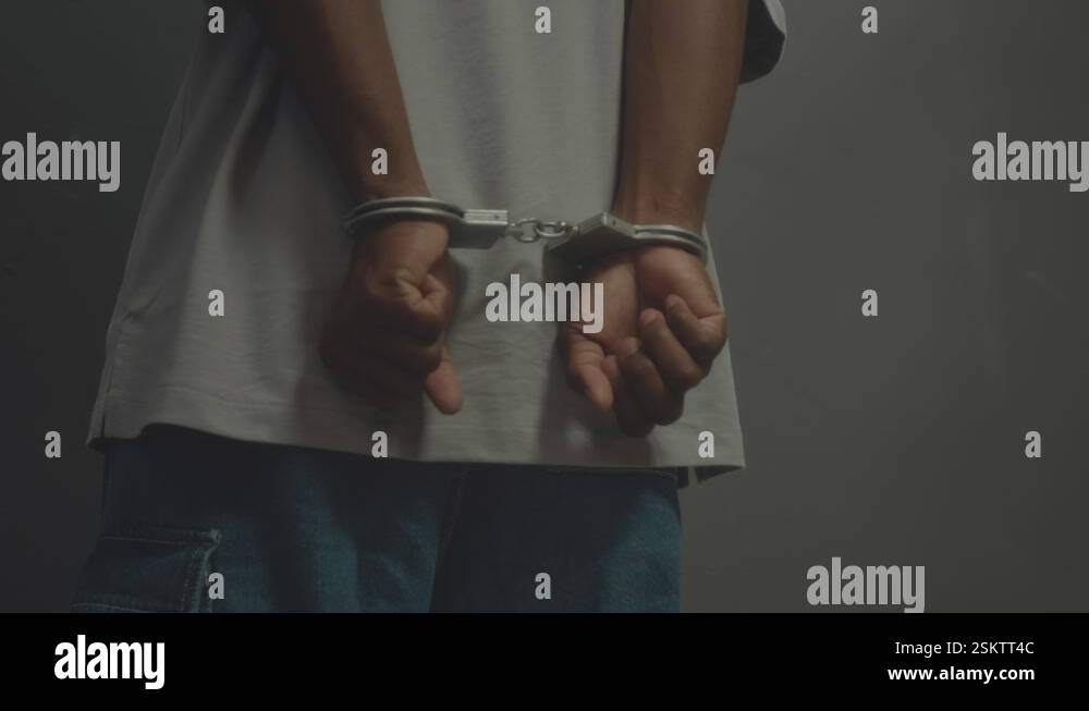Man hands handcuffed behind back Stock Videos & Footage - HD and 4K ...
