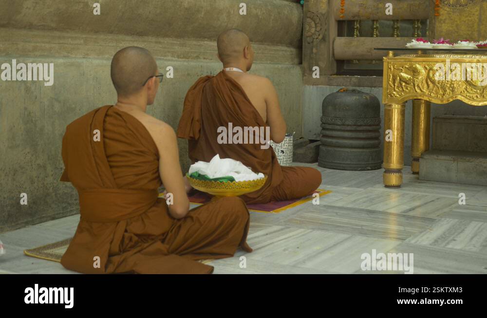 Chinese monks meditating at Mahabodhi Temple, from the back, Bodhgaya ...
