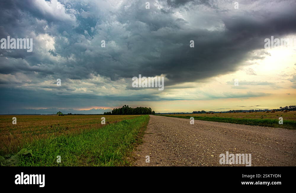 Formation of powerful storm clouds with sun rays trying to shine trough ...
