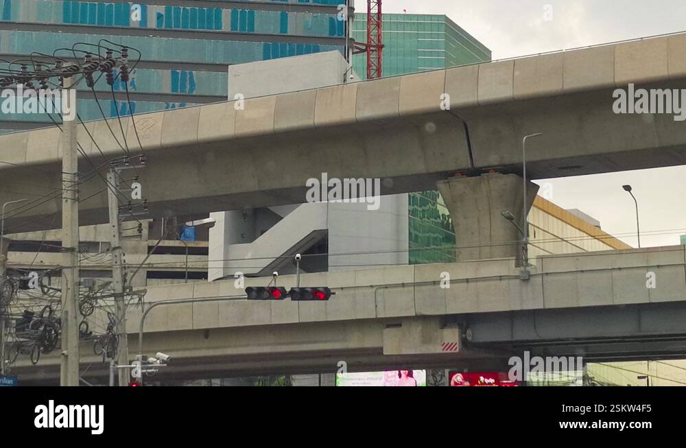 Traffic Lights and the BTS Skytrain Monorail Line at Ratchayothin Stock ...