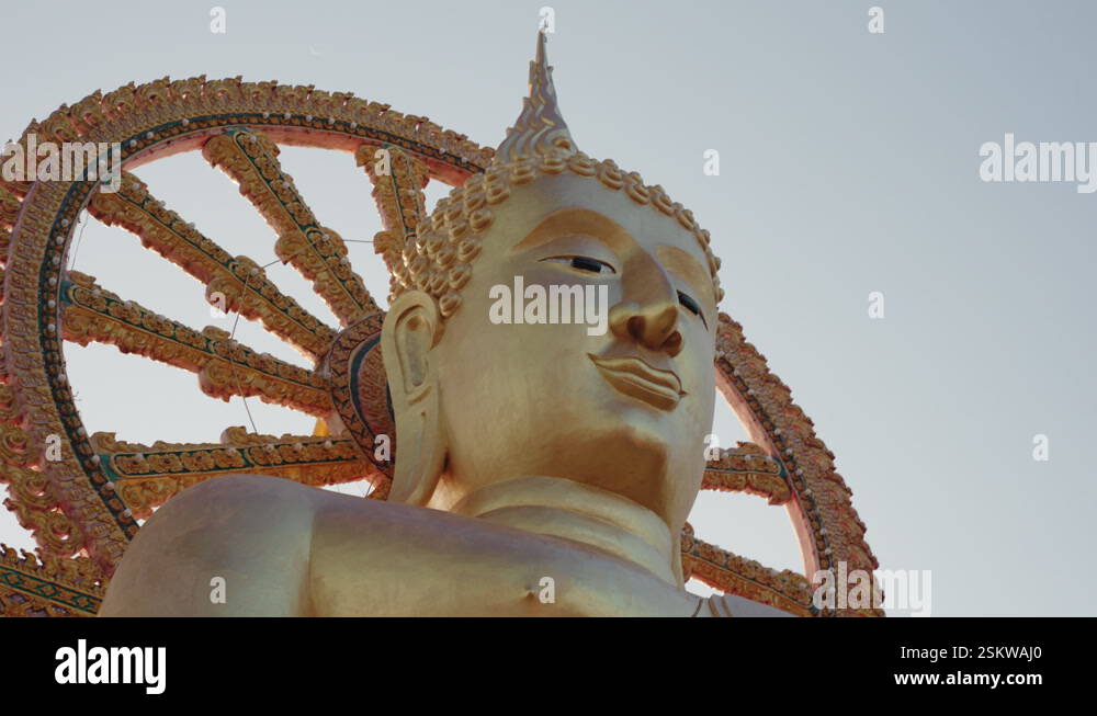 Close up view face and arm of giant sitting golden buddha in Koh Samui ...