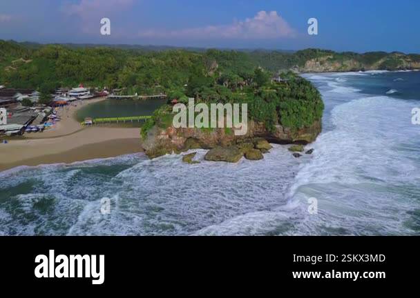 Drone view of white sandy beaches, coral rocks, hills with trees, big ...