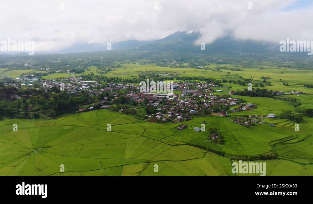 An Aerial View Of Spider Web Rice Fields And A Village On A Green ...