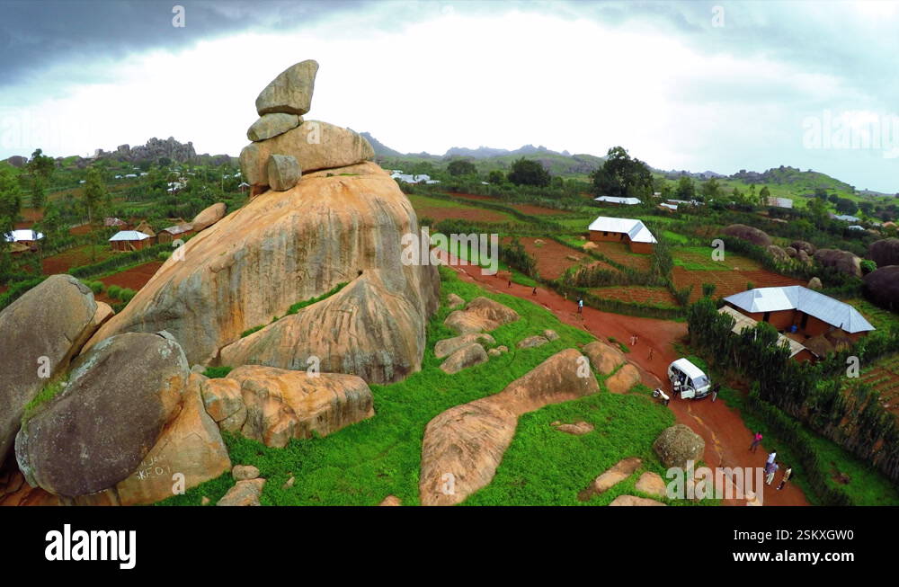 Farming community in the Plateau State of Nigeria with an iconic rock ...