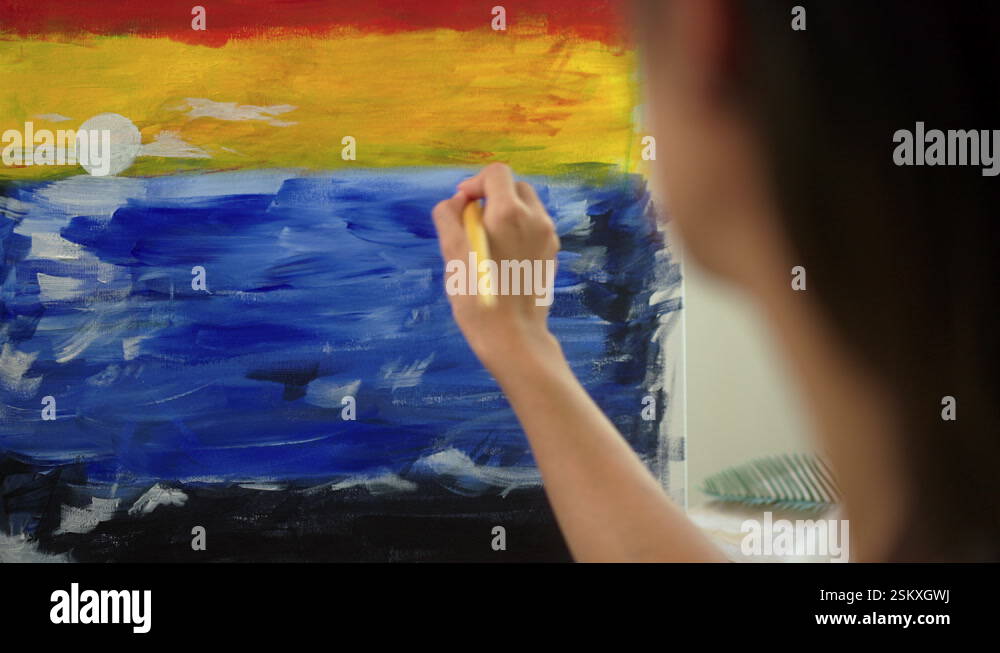 Close-up Moving Paint brush holding on hand of artist and painting on ...