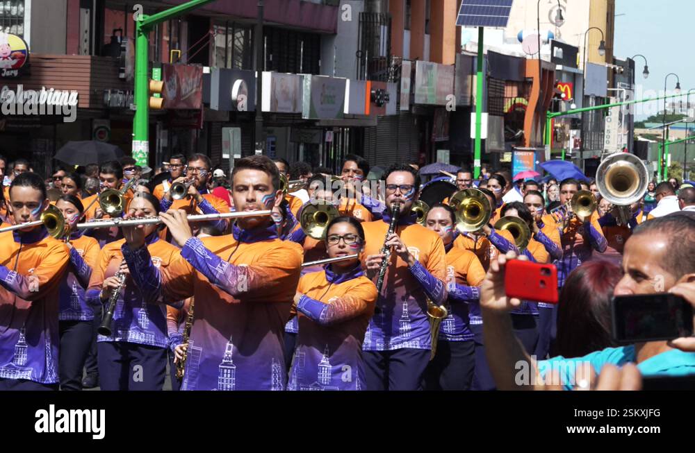 Wind Section Of Marching Band Walking Down Avenue During Costa Rican ...