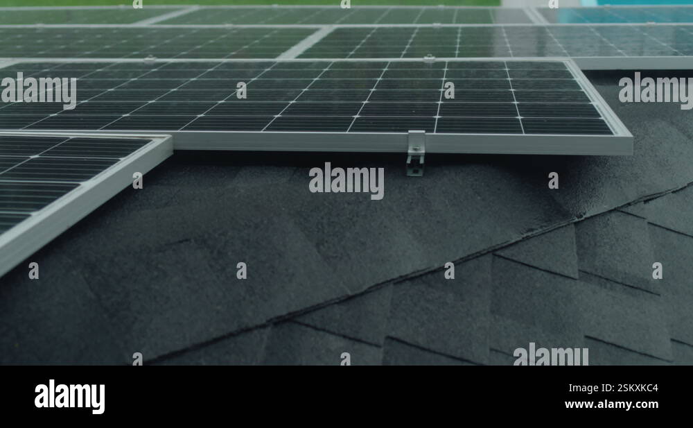 Drops of rain fall on the solar panels on the roof of the house Stock ...