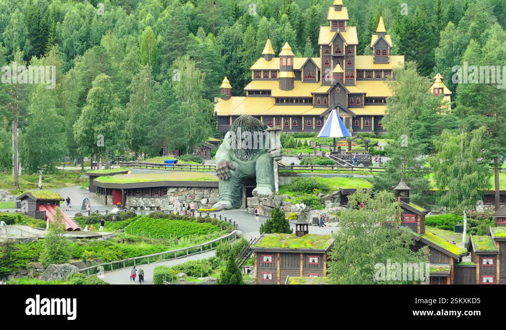 Troll sit in front of Hunderfossen adventure park fairytale castle ...