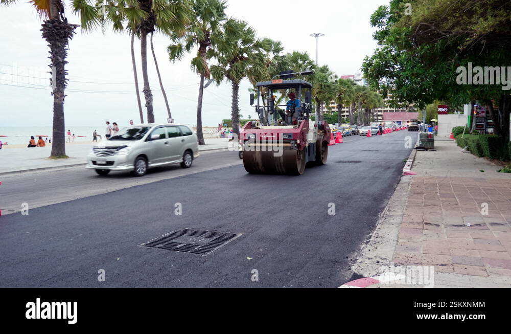 Laying a renewed asphalt by paver and compaction new asphalt pavement ...