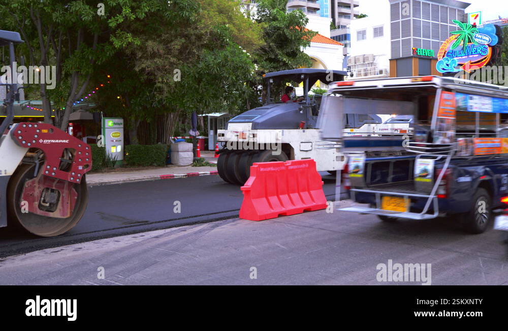 Laying a renewed asphalt by paver and compaction new asphalt pavement ...