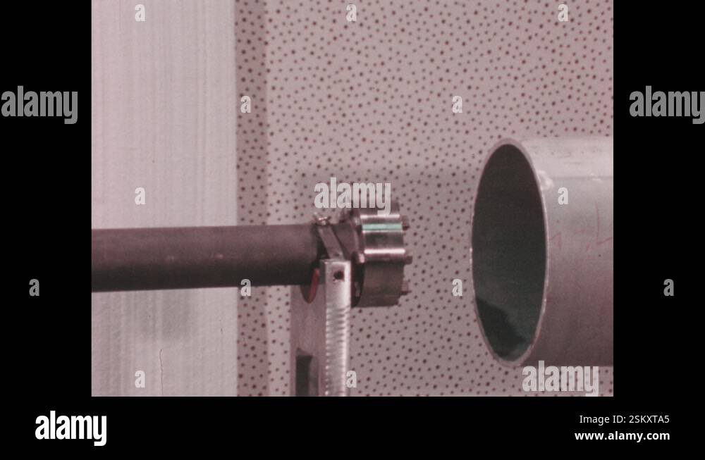 1960s: Metal tube in front of particle detector. Hand showing the path ...