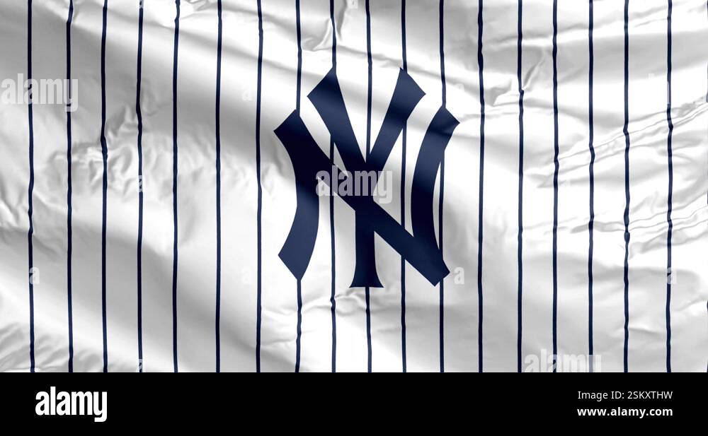 A waving flag of cap and uniform insignia for the New York Yankees ...