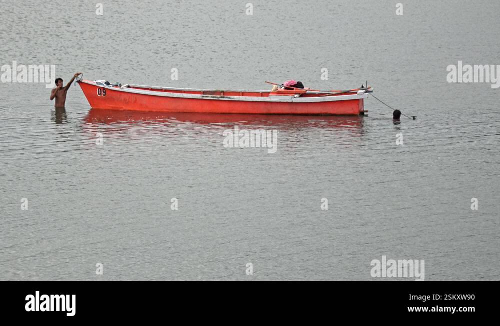 Sand Miners Anchor an Orange Boat in the Surigao River to Dig for River ...
