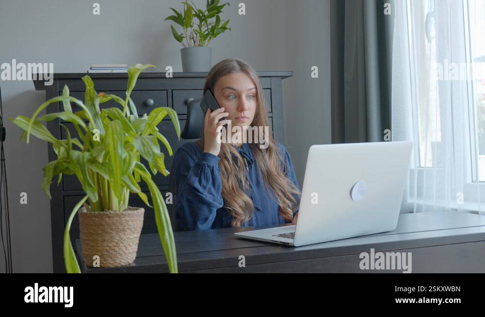 Worried woman on a phone call while at work surprise blink and touch ...