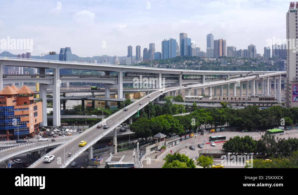 Metropolitan urban city life in asia as public transit trains cross on ...