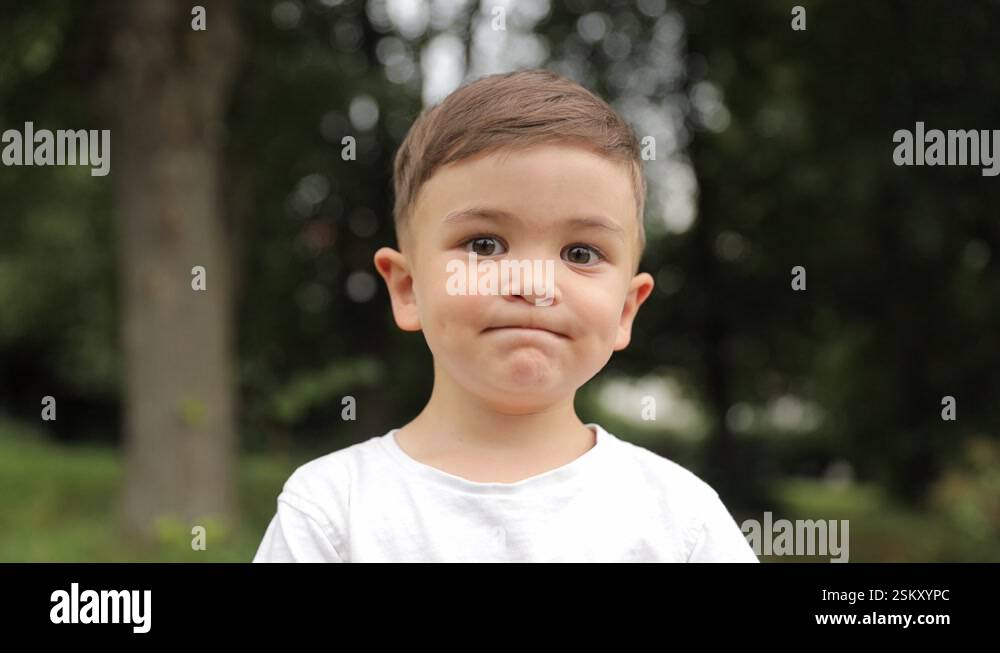 Happy little boy smiling looking at camera. Portrait of a smiling child ...