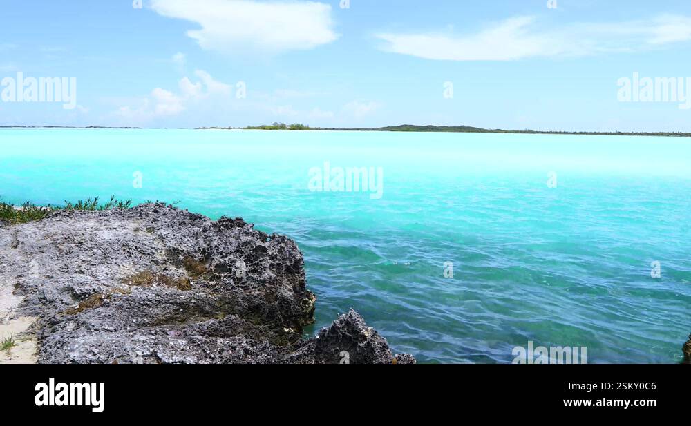 Static video of the ocean on Exuma in the Bahamas. There is a rock ...