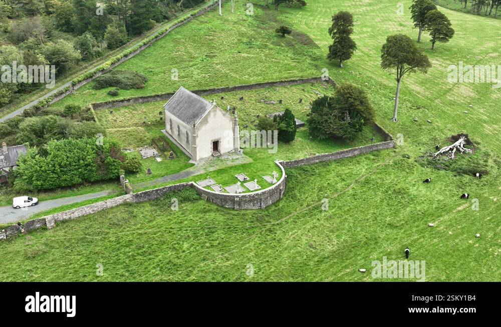 aerial circling old church and cemetery in Waterford Ireland on a dull ...