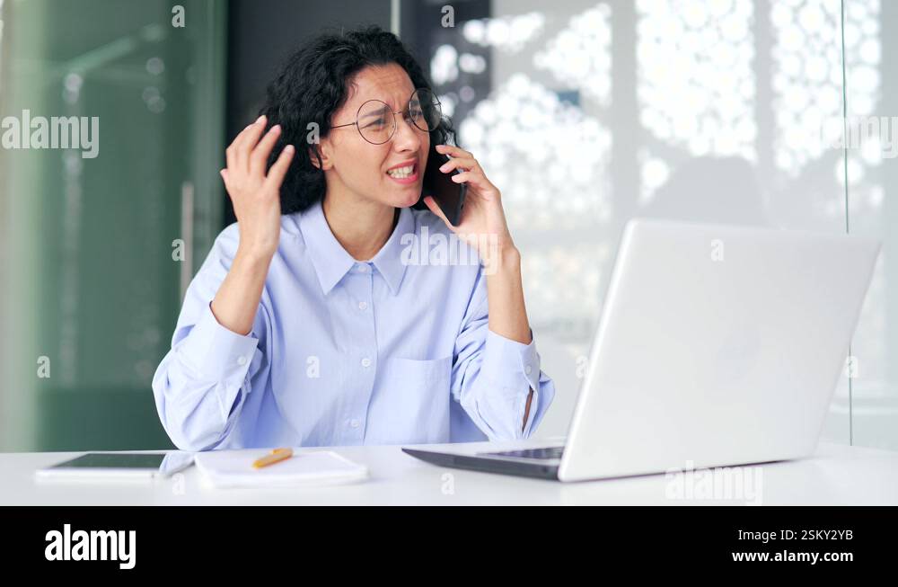 Angry female employee or manager arguing talking on mobile phone while ...