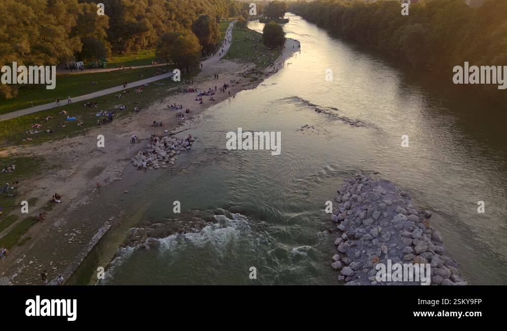 Majestic aerial top view flight Munich river Isar beach bridge Park ...