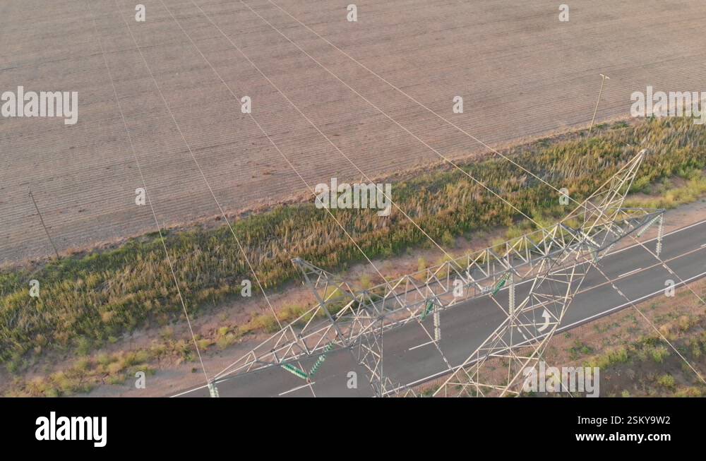 Flyover high voltage electric tower. Power supply line, electricity ...