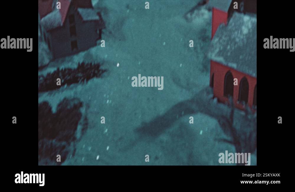 1940s: Tracking shot, moving over model of town. Animation, man and dog ...