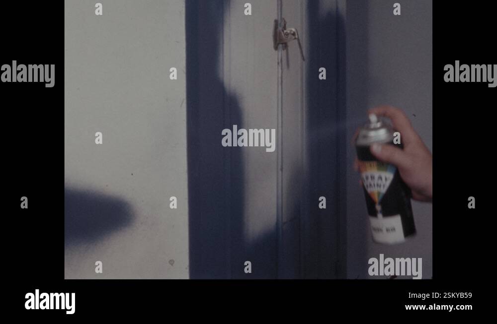1960s: Hand with aerosol can spray paints door Stock Video Footage - Alamy