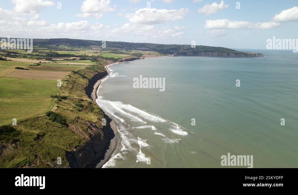 Aerial drone footage of North Yorkshire coastline,Ravenscar with green ...