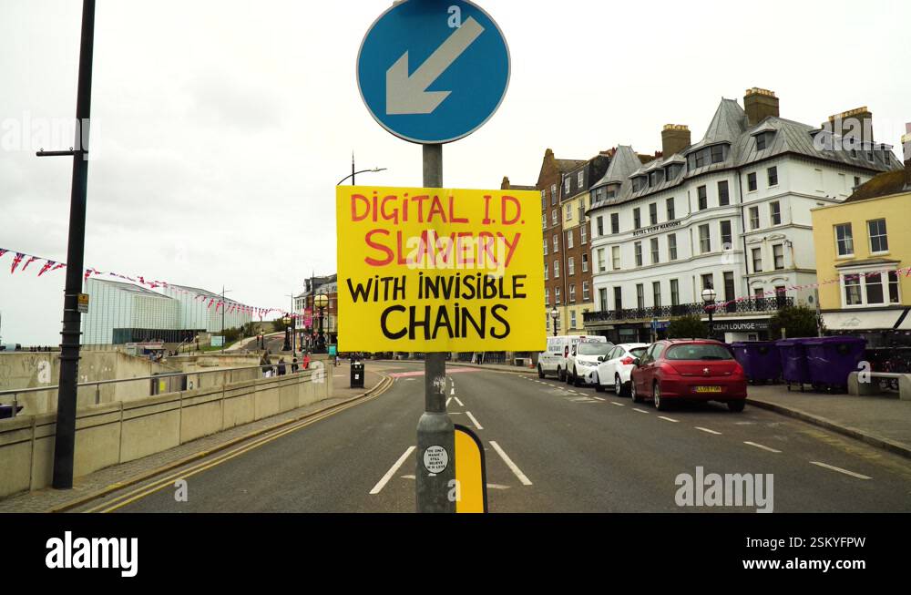 very visible yellow sign from protestors hanging on a light pole in the ...