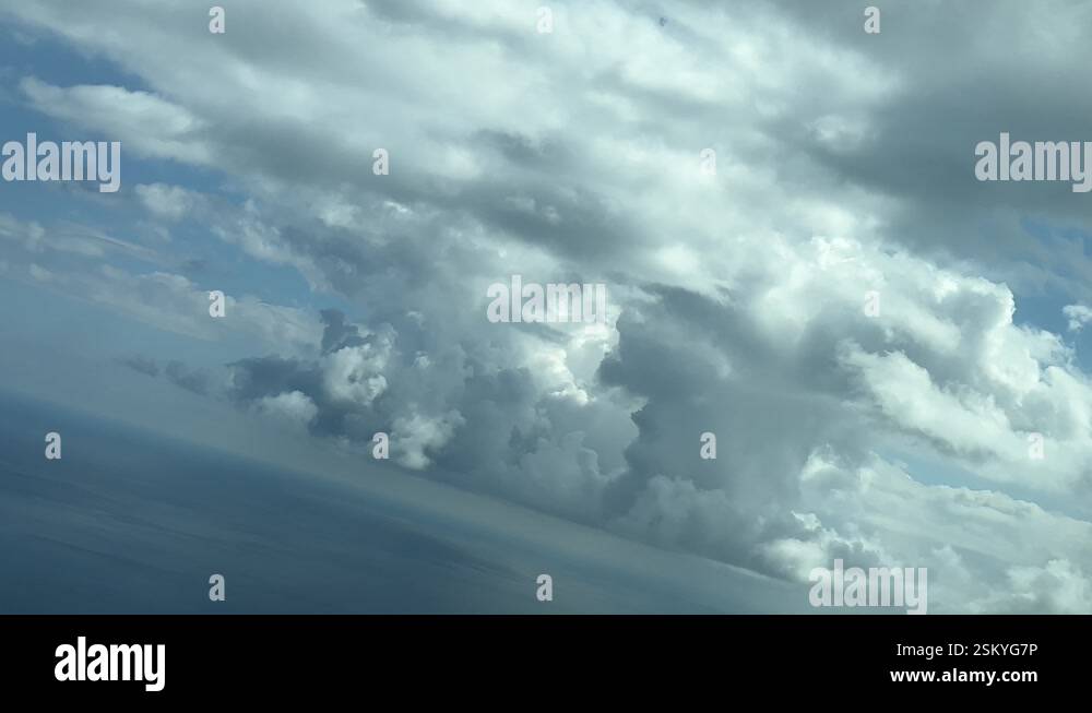 Flying across a clouded sky in a left turn, as seen by the pilots. Shot ...