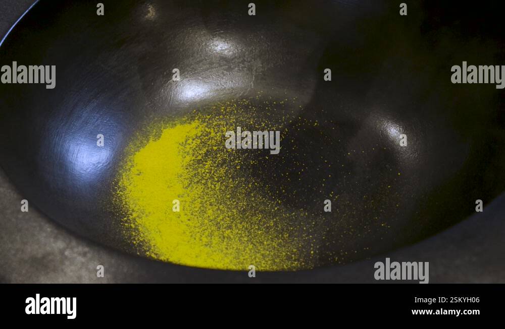 Sprinkling powder into a tub preparation for a refreshing foot bath at ...