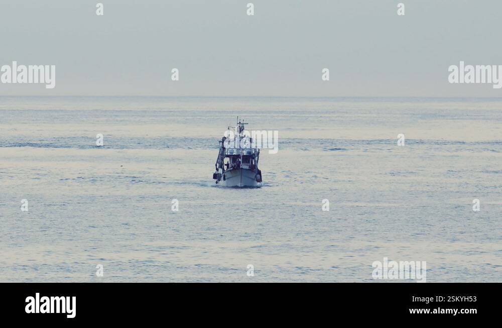 004 Front view of a fishing boat sailing on the northeastern coast of ...