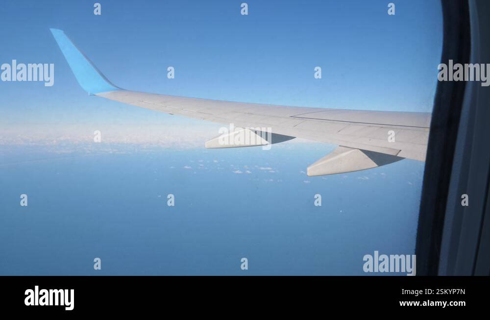 Airplane wing. Air View from plane window on sea. Travel and transport ...