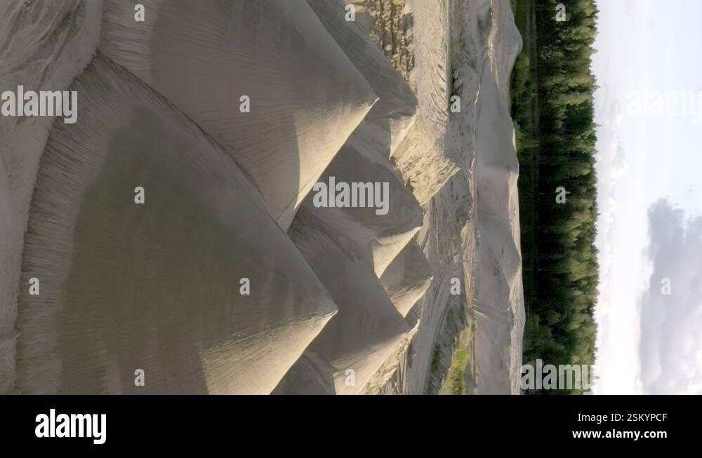 Sand piles in a mining area.Camera moves slowly from left to right ...