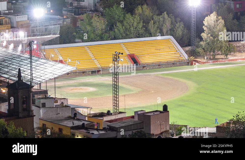 Timelapse footage of the big baseball field at night in the city of ...