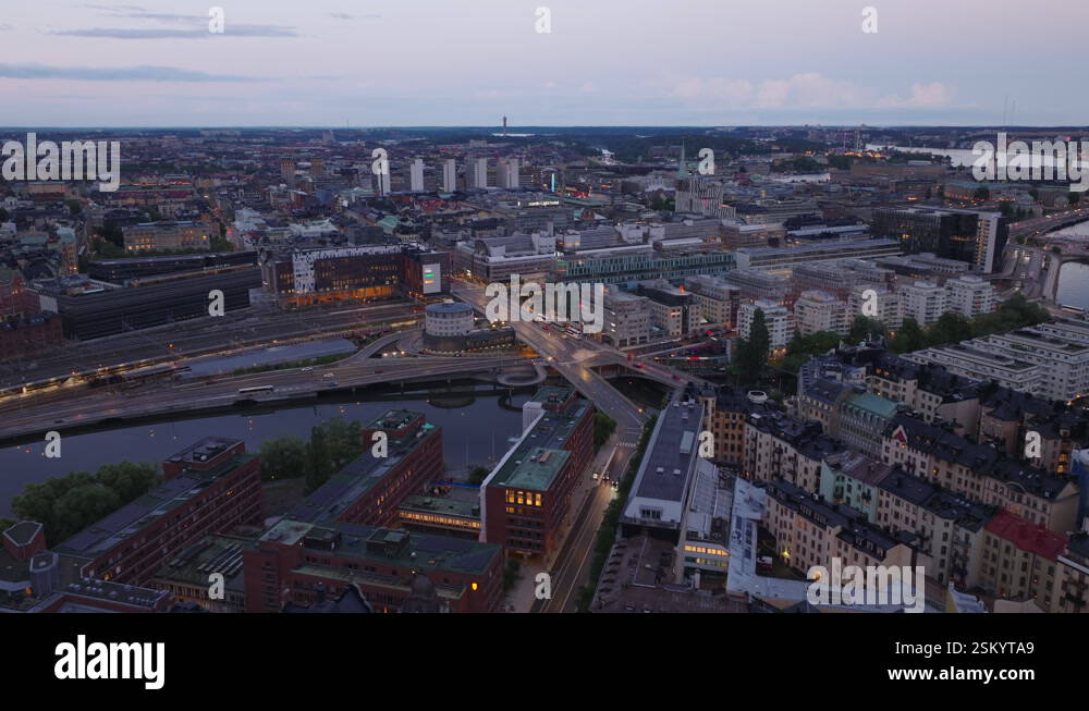 Aerial slide and pan shot of traffic on roads and bridges over water in ...
