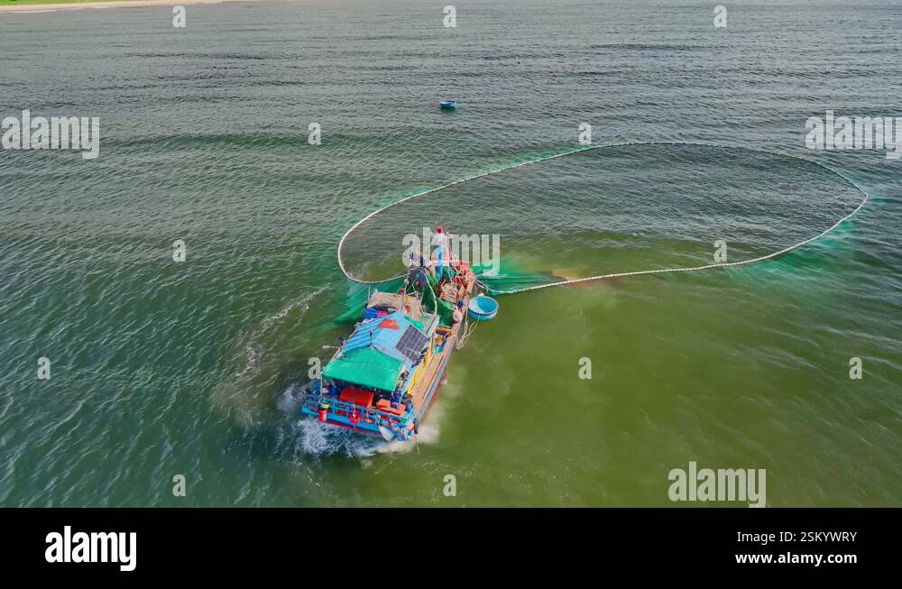 Drone view of fishing boat is netting anchovy on the sea of Ke Ga, Binh ...