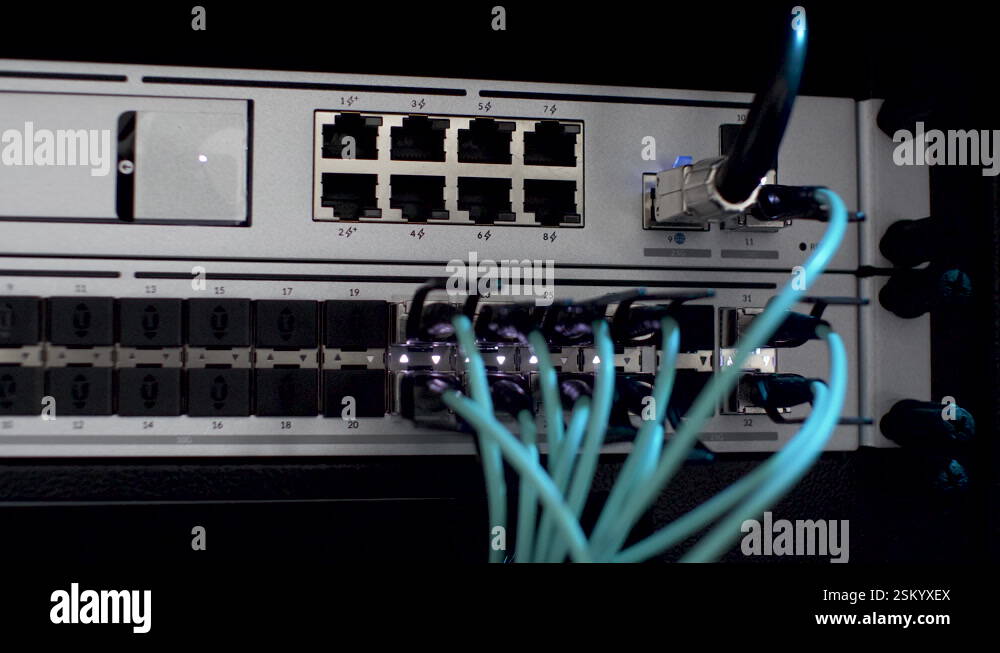 LAN and Fibre Optic Cables Plugged In Network Server Rack With White ...