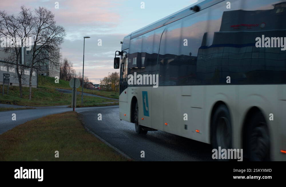 Buses Driving On The Street At Sunrise In Tromso, Norway. wide Stock ...