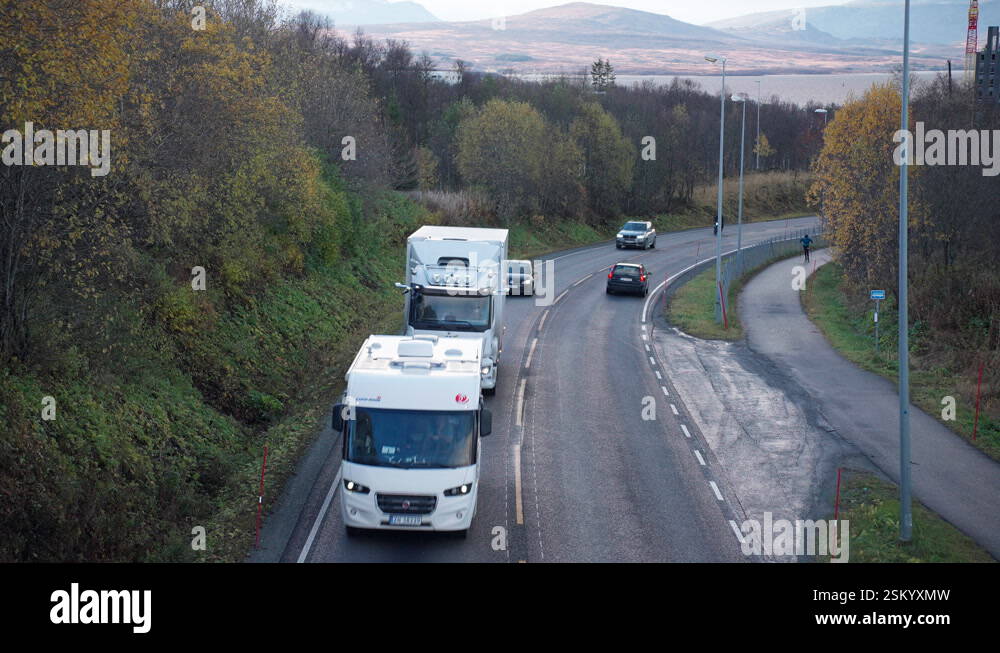Traffic On The Road. Man Is Roller Skating With Sticks During Sunset In ...