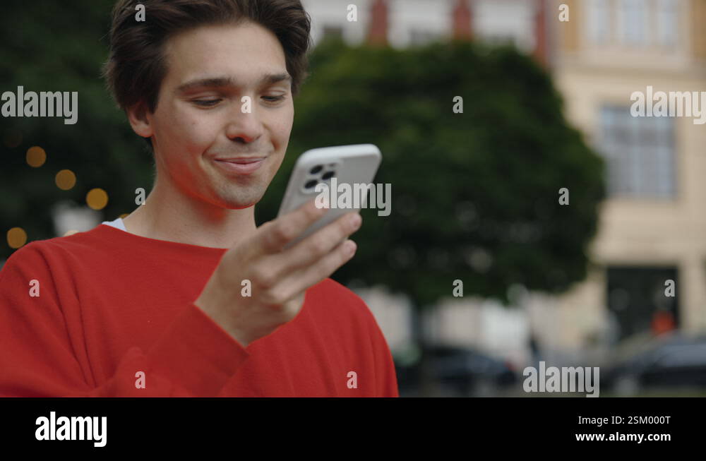 Attractive Man Making Voice Message or Using Virtual Assistant App on ...