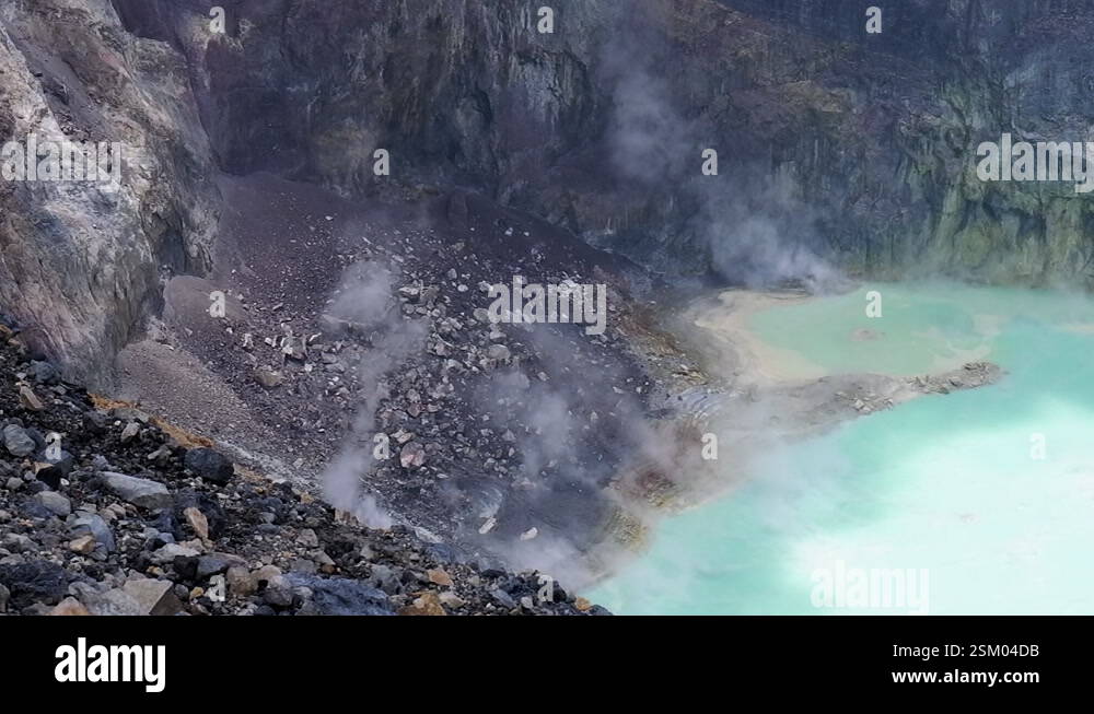 Steam rises off opaque green lake in crater of Santa Ana Volcano, SLV ...