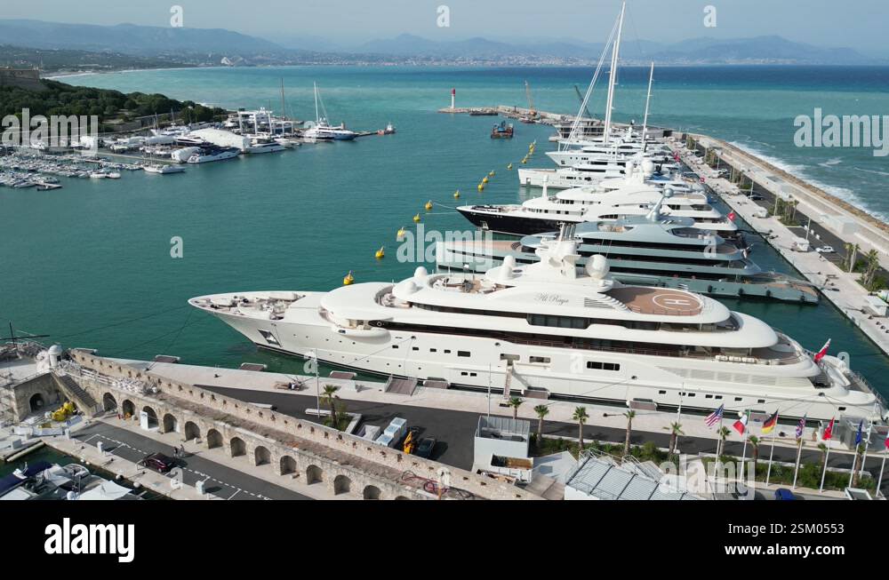 Superyachts moored at Cannes France drone, aerial slow panning shot ...