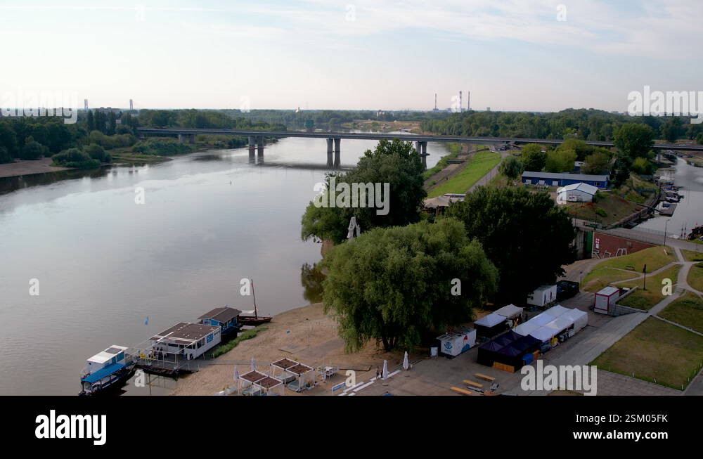 A Bridge Crossing a River In Warsaw, Poland Aerial Gaze at Rural Area ...