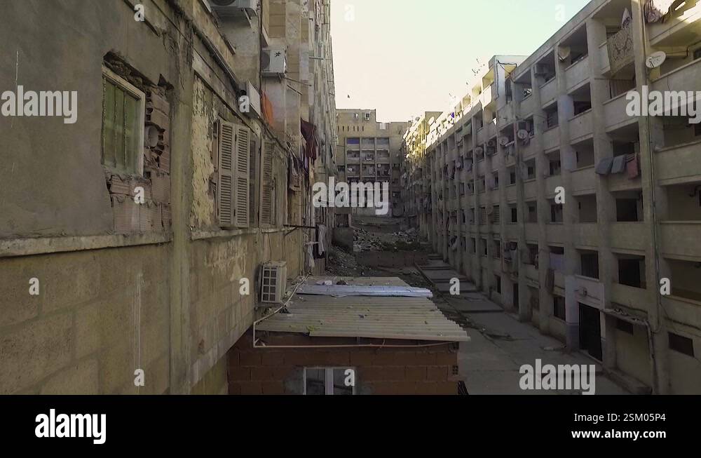 building in a dangerous ghetto with satellite dishes and laundry ...