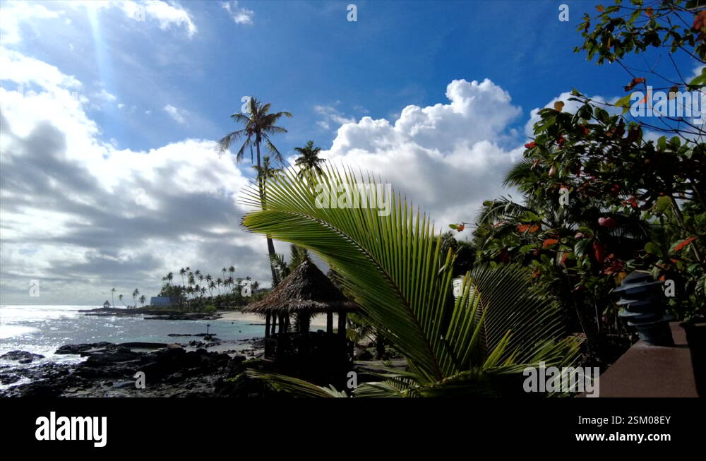 Motion lapse of clouds movings across a Samoan tropical coastline Stock ...