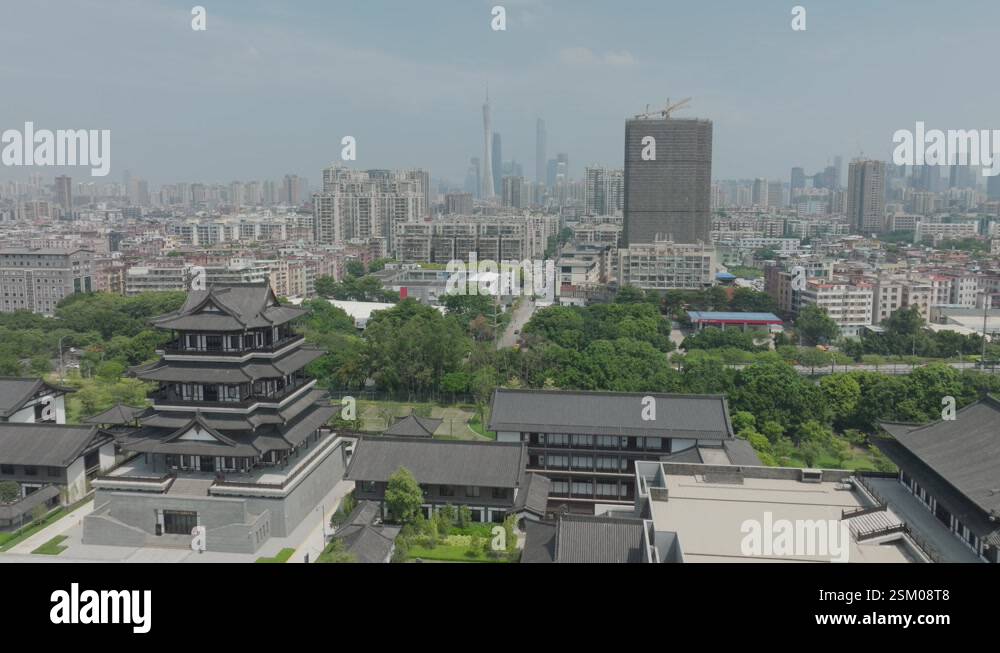 Eastern Chinese heritage town with buildings and a city in the distance ...