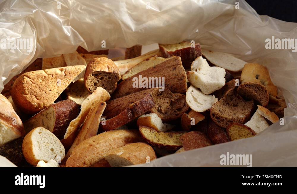Leftover bread in a garbage bag. Food industries waste Stock Video ...