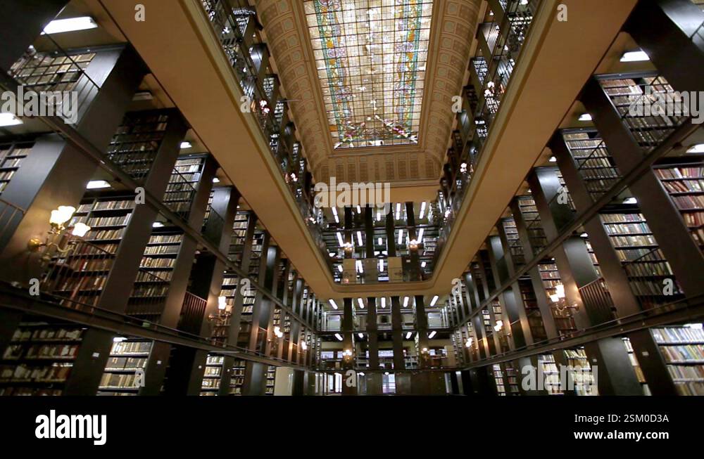 indoors camera pan showing the collection and the national library ...